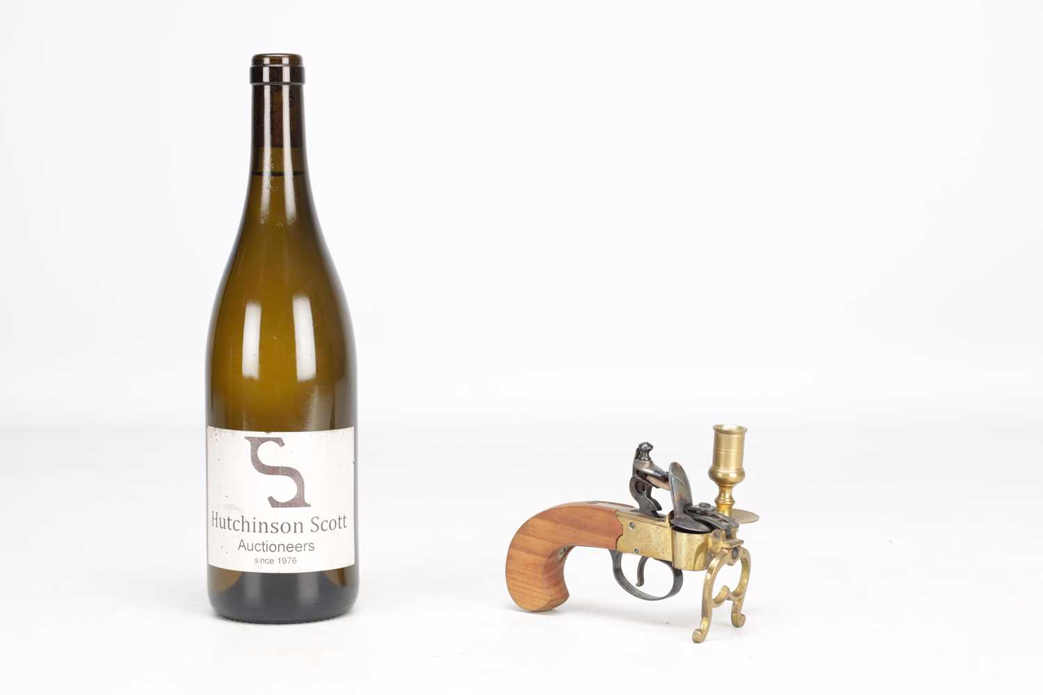 AN EARLY 19TH CENTURY BRASS AND STEEL FLINTLOCK TINDER