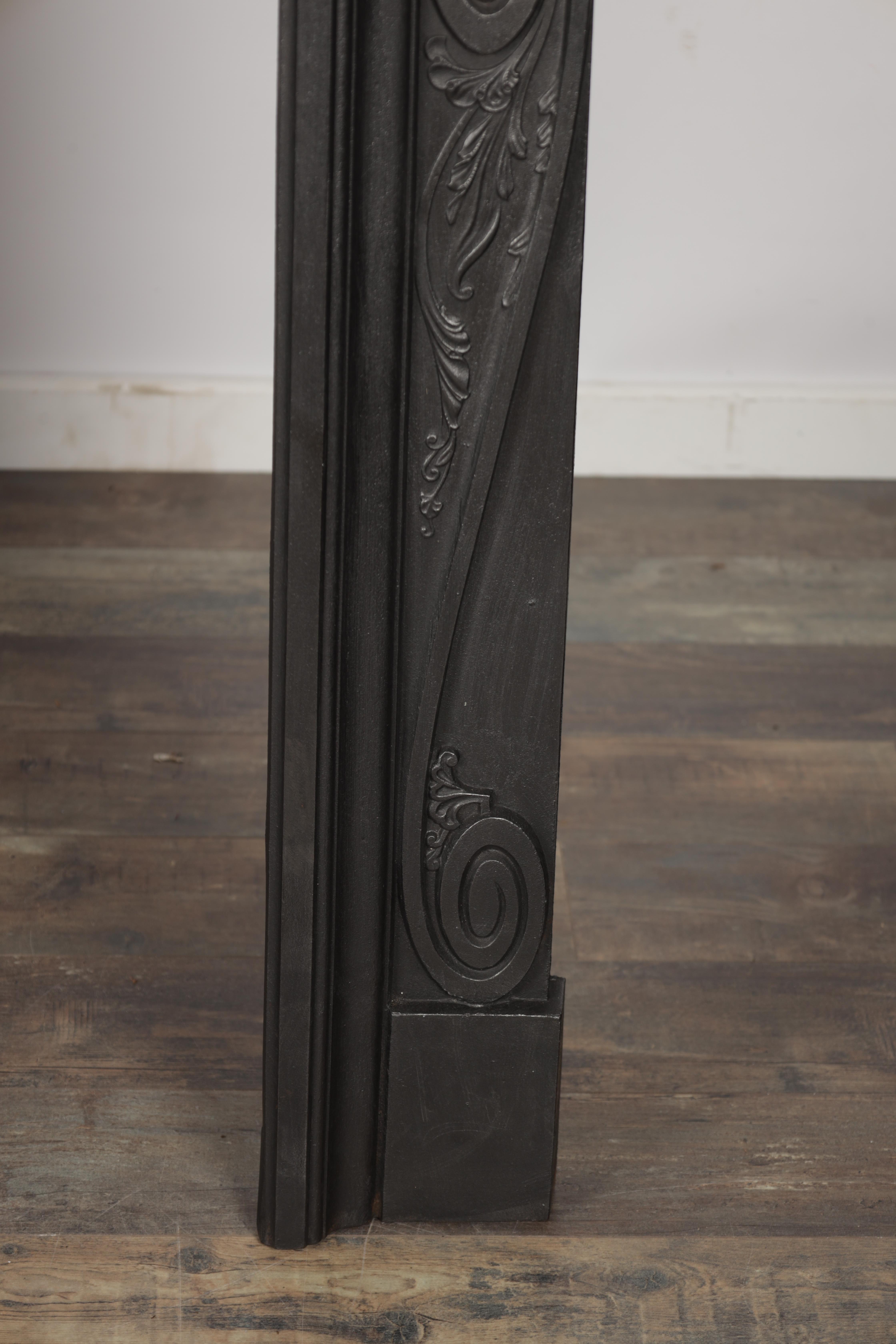 Lot 1585 - A VICTORIAN CAST IRON FIRE SURROUND