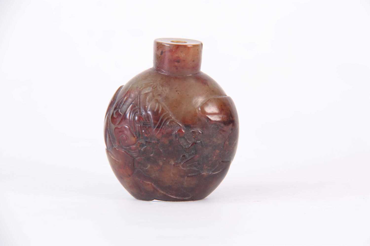 Lot 97 - A 19TH CENTURY CHINESE CARVED RUSSETT JADE